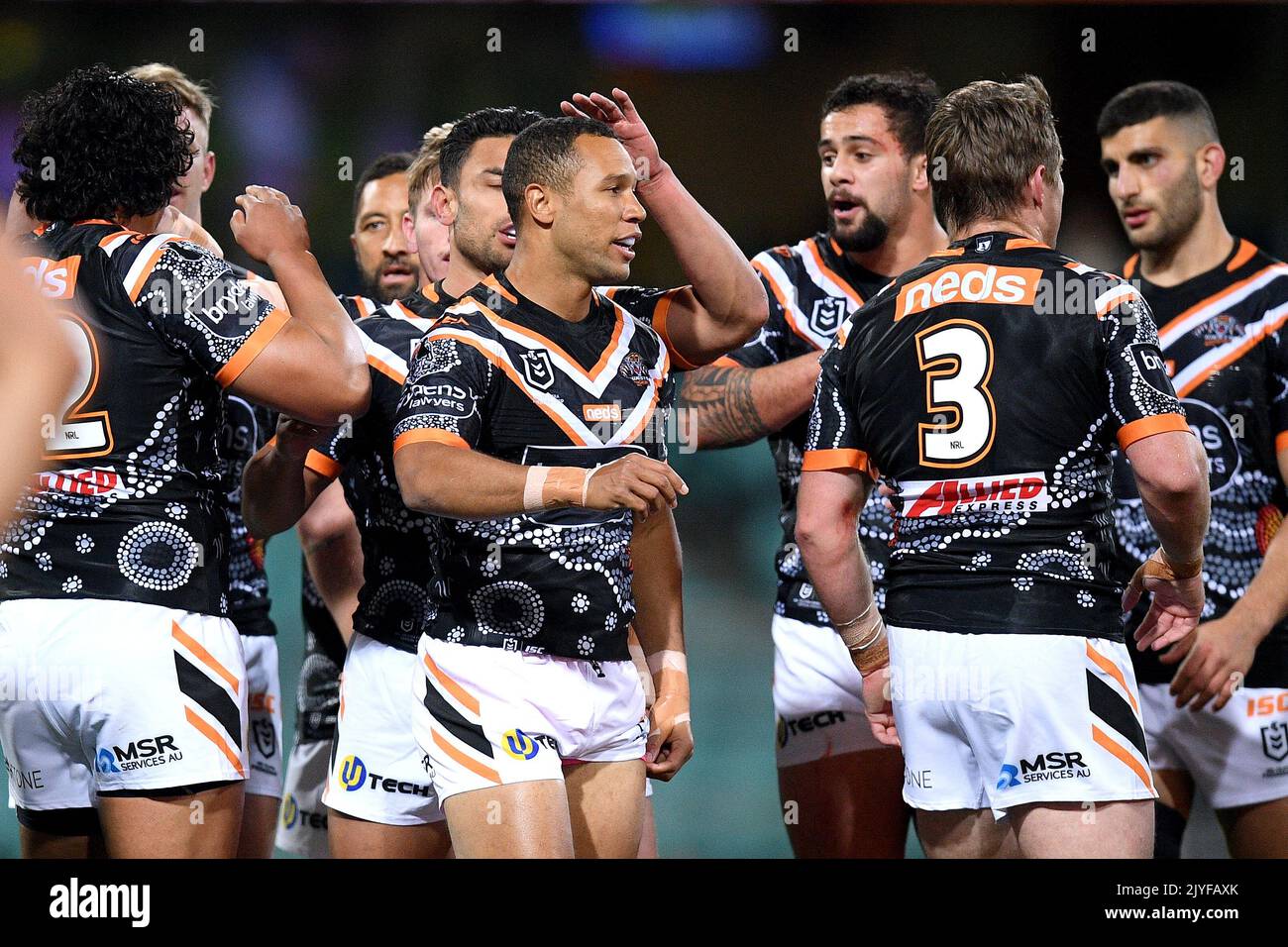 Moses Mbye of the Tigers (centre) celebrates with teammates after ...