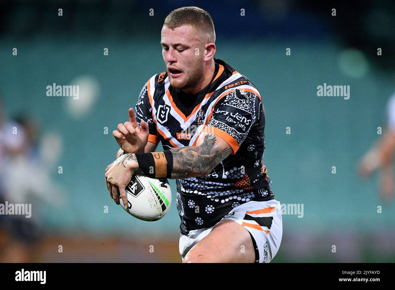 Sam McIntyre of the Tigers gestures after scoring a try during the ...