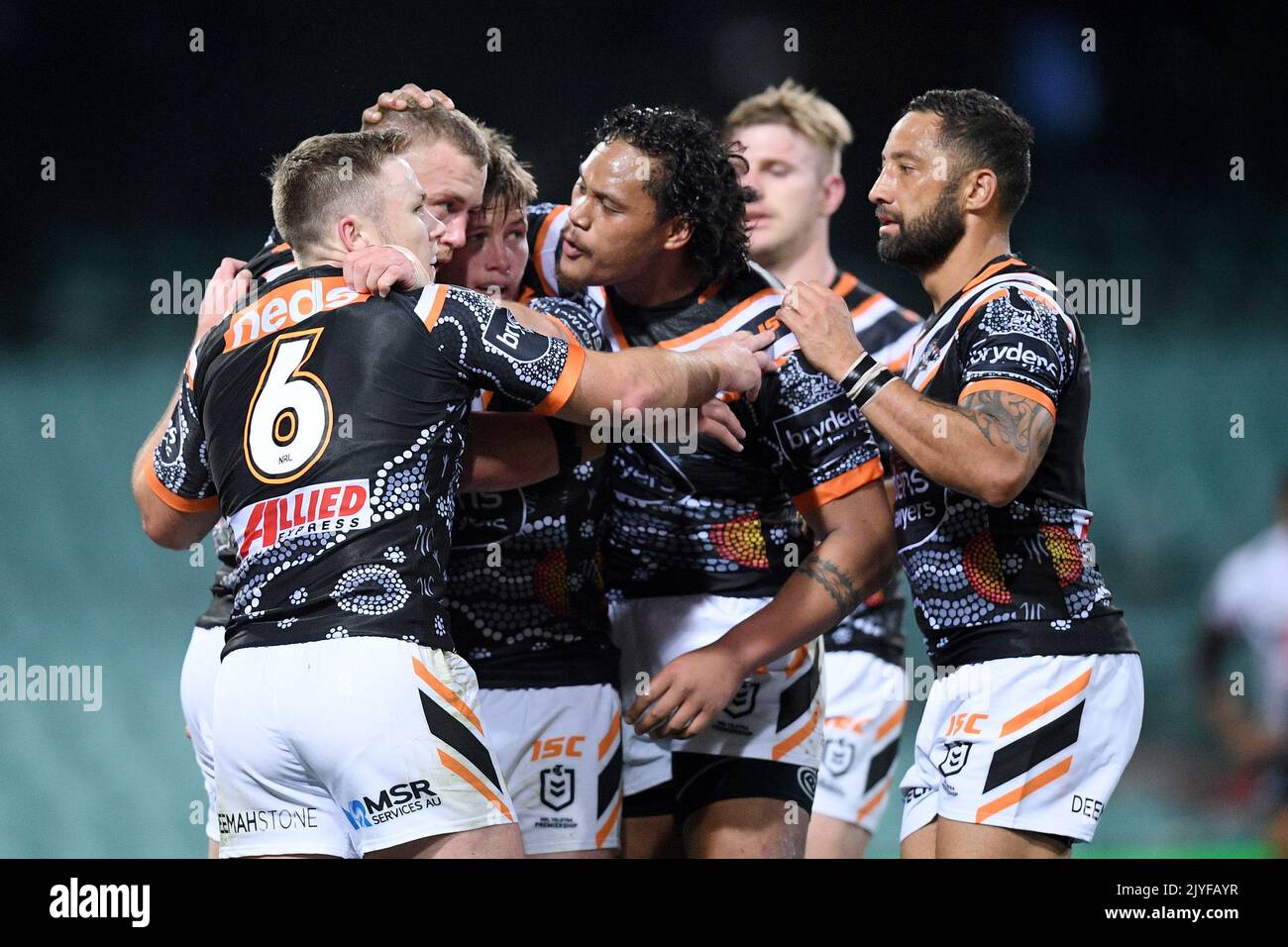 Sam McIntyre of the Tigers (second left) celebrates with teammates ...