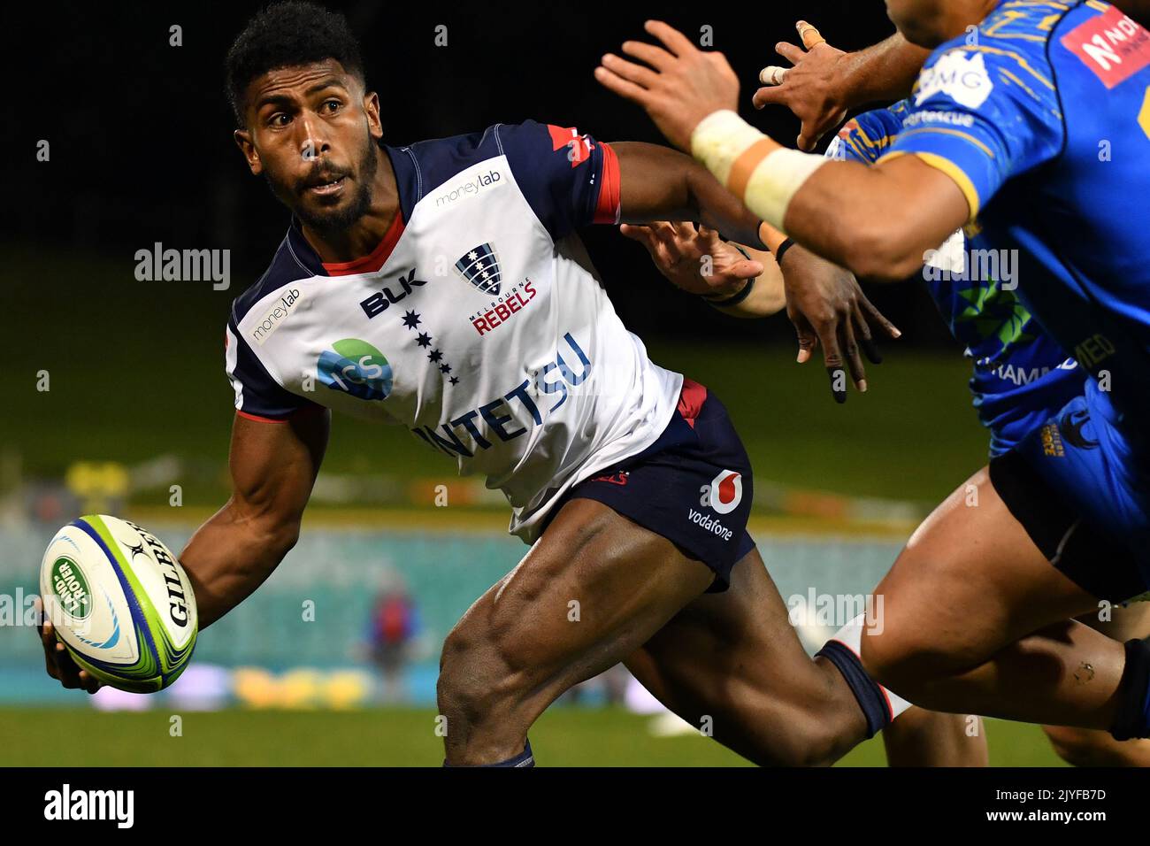 Frank Lomani of the Rebels off loads after making a break during the ...