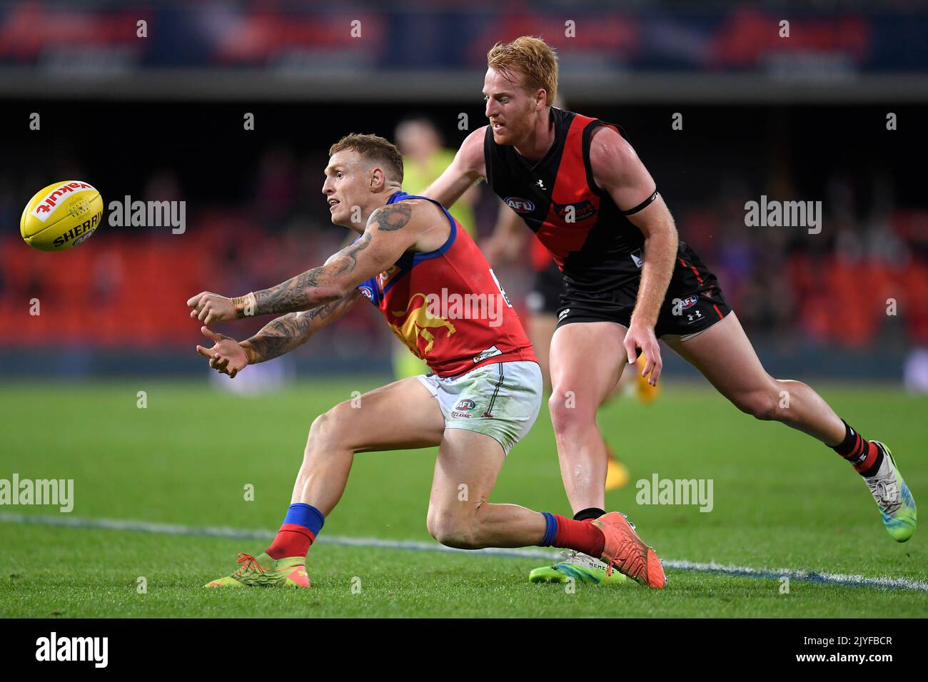 Mitch Robinson of the Lions handballs during the Round 9 AFL match ...