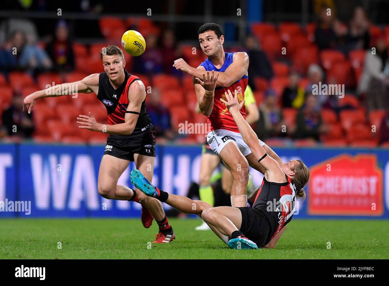 Connor Ballenden of the Lions handballs during the Round 9 AFL match ...