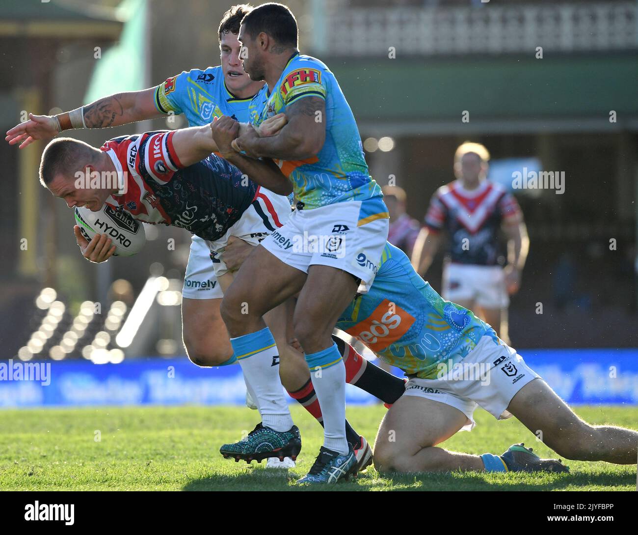 Lindsay Collins of the Roosters is tackled during the Round 12 NRL ...