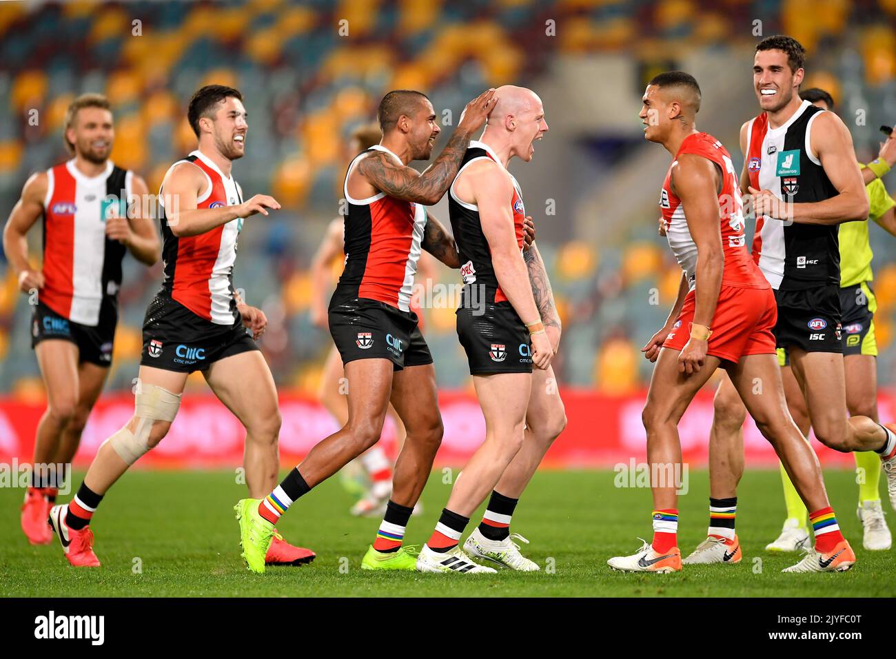 Zak Jones of the Saints (centre) celebrates kicking a goal during the ...
