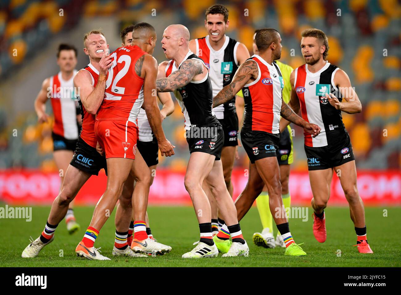 Zak Jones of the Saints (3rd left) confronts James Bell of the Swans ...