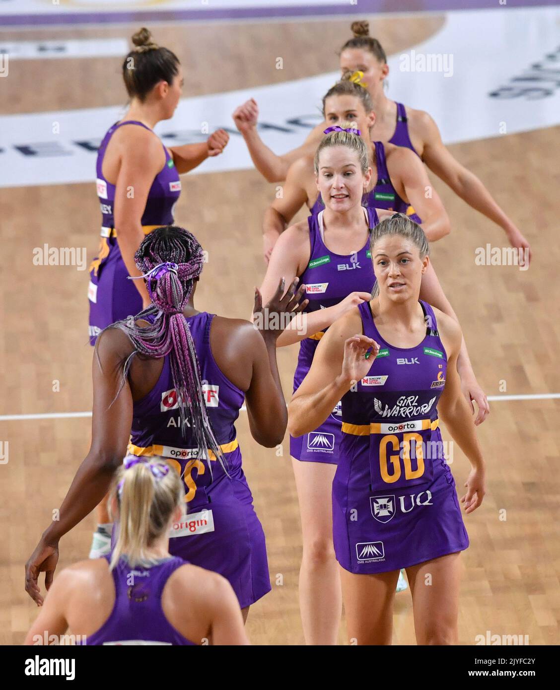 Kim Jenner (right) of the Firebirds is seen with tea mates during the ...
