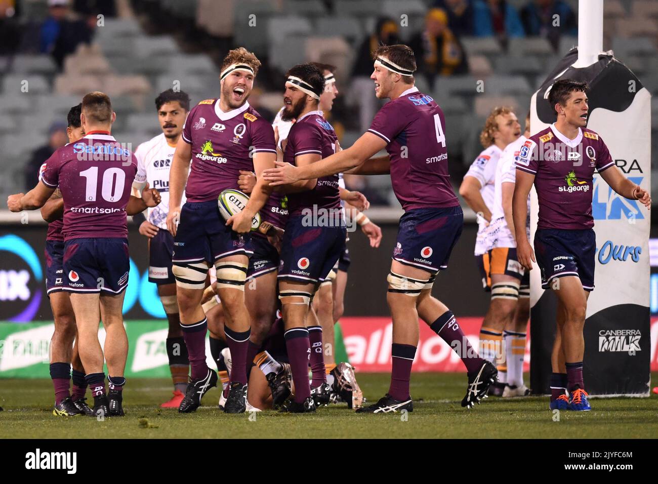 Queensland Reds players celebrate after scoring a try during the Round ...
