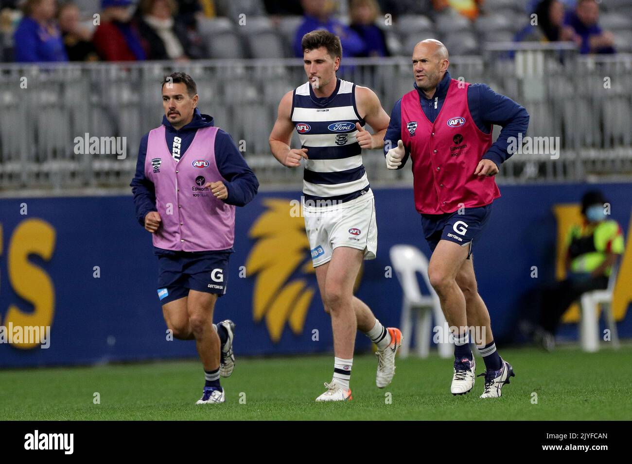 Charlie Constable of the Cats leaves the field after a collision during ...