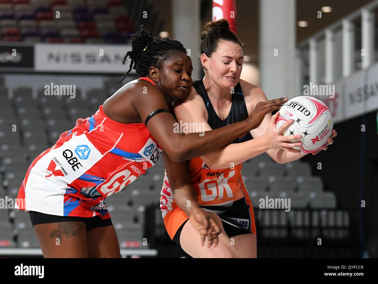 Sam Poolman of the Giants (right) and Sam Wallace of the Swifts compete ...