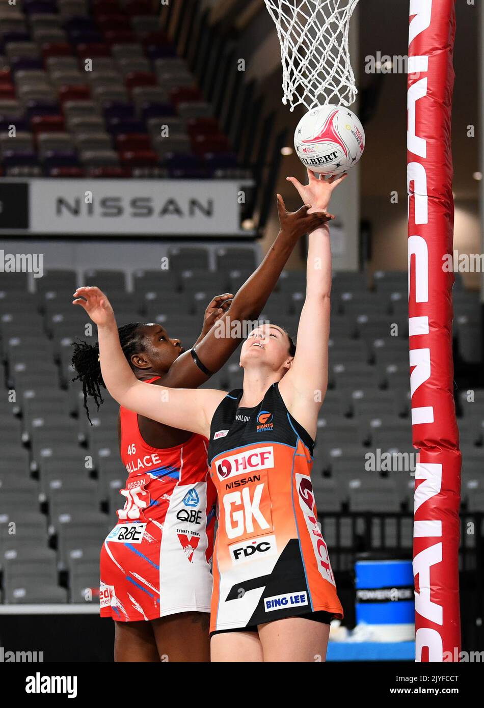 Sam Poolman of the Giants (right) and Sam Wallace of the Swifts compete ...