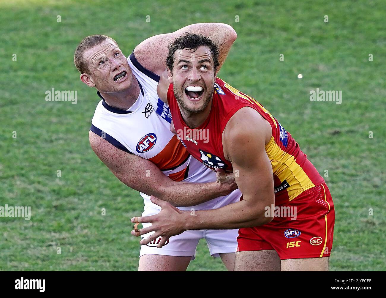 Sam Jacobs of the Giants (left) competes with Charlie Ballard of the ...
