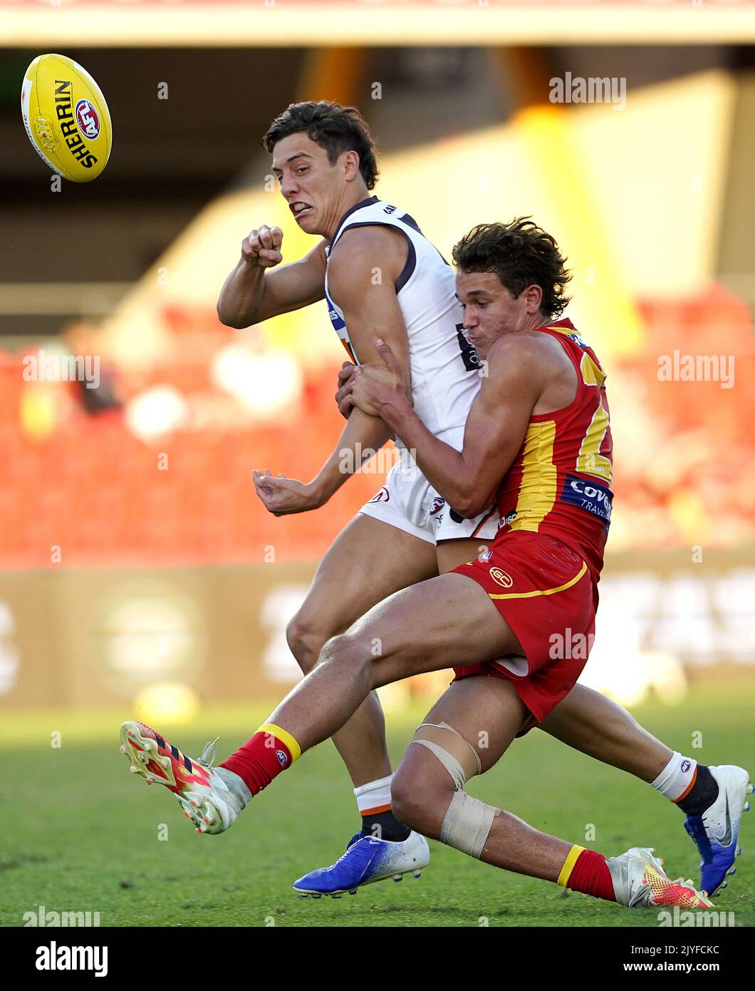 Sam Flanders of the Suns tackles Aye Caldwell of the Giants during the ...