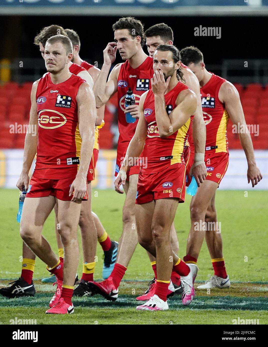 Suns players leave the field following the Round 9 AFL match between ...