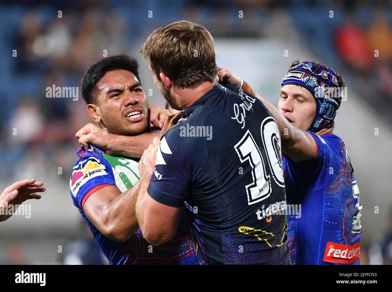 Hymel Hunt (left) of the Knights grapple with Christian Welch (centre ...