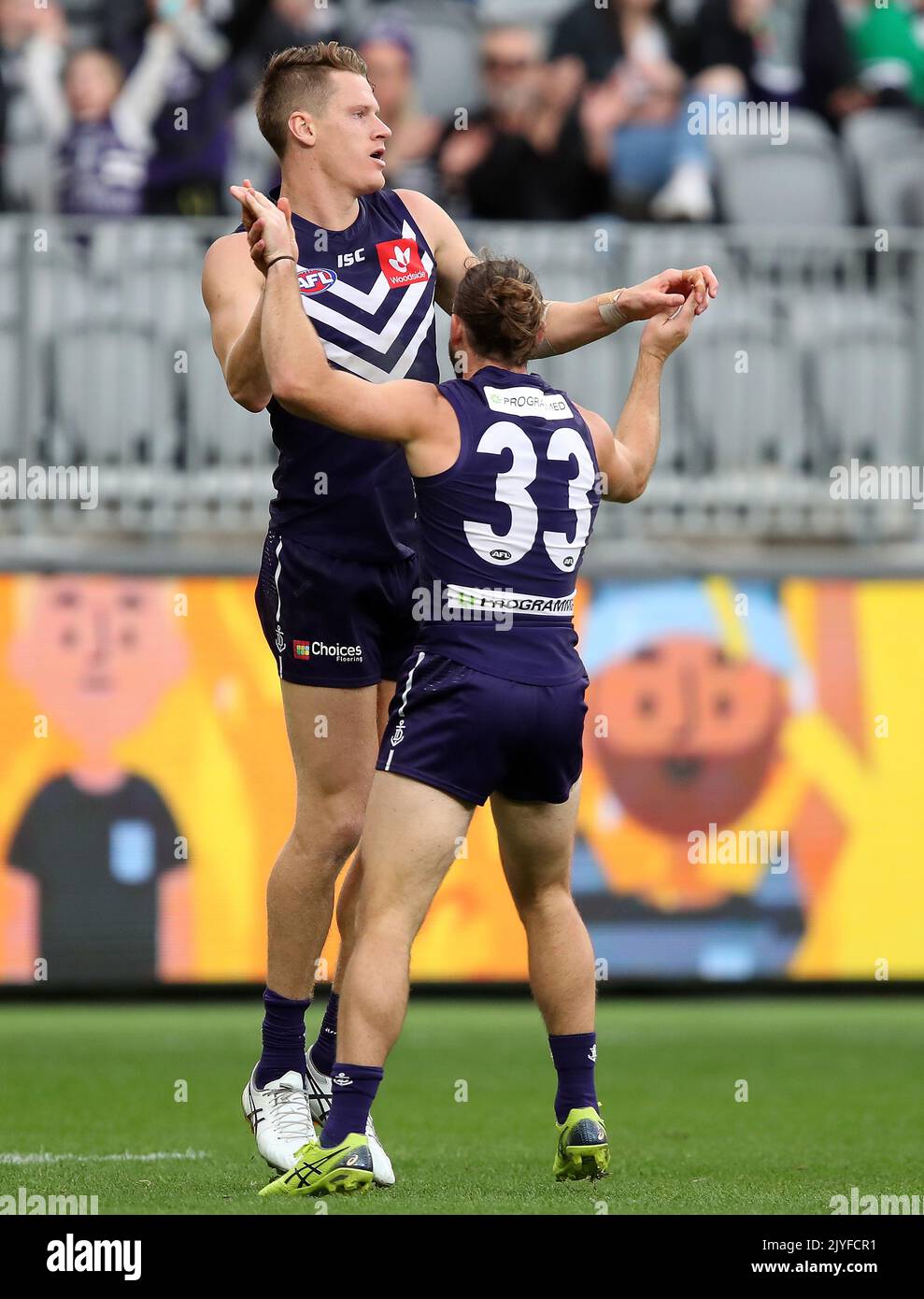 Matt Taberner of the Dockers celebrates kicking a goal with Travis ...