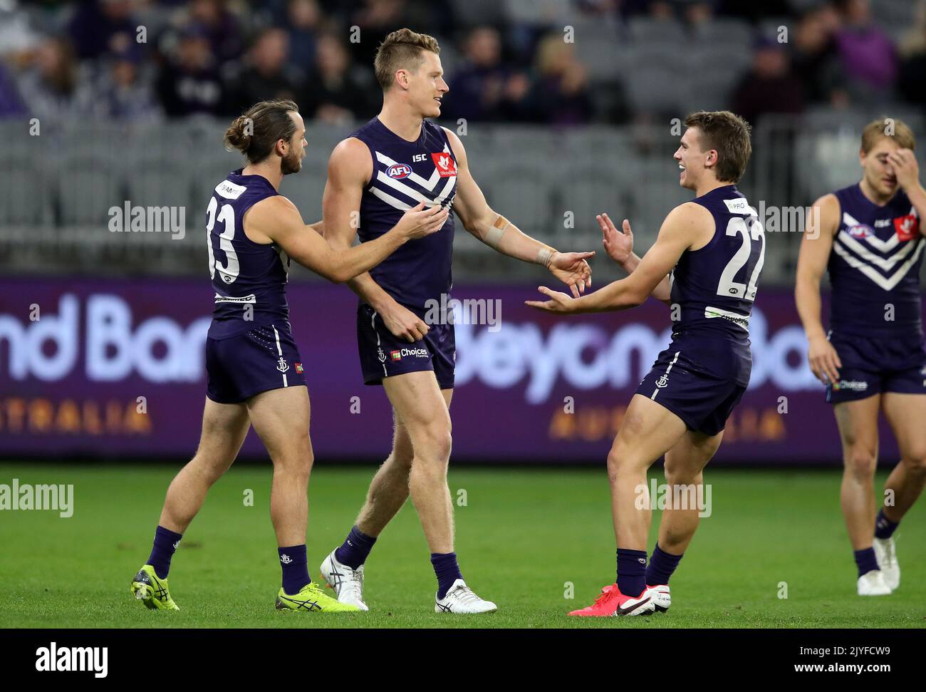 Matt Taberner of the Dockers celebrates kicking a goal with Travis ...