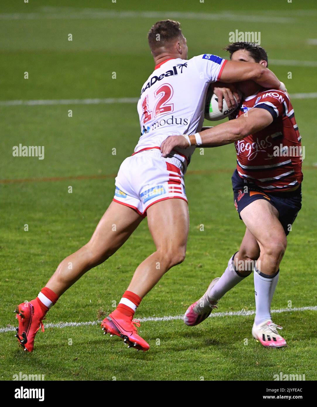 Dragons Tariq Sims tackles Roosters Nat Butcher during the Round 13 NRL ...