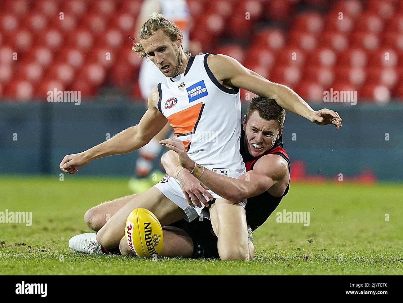 Jacob Townsend of the Bombers tackles Nick Haynes of the Giants during the Round 10 AFL match ...