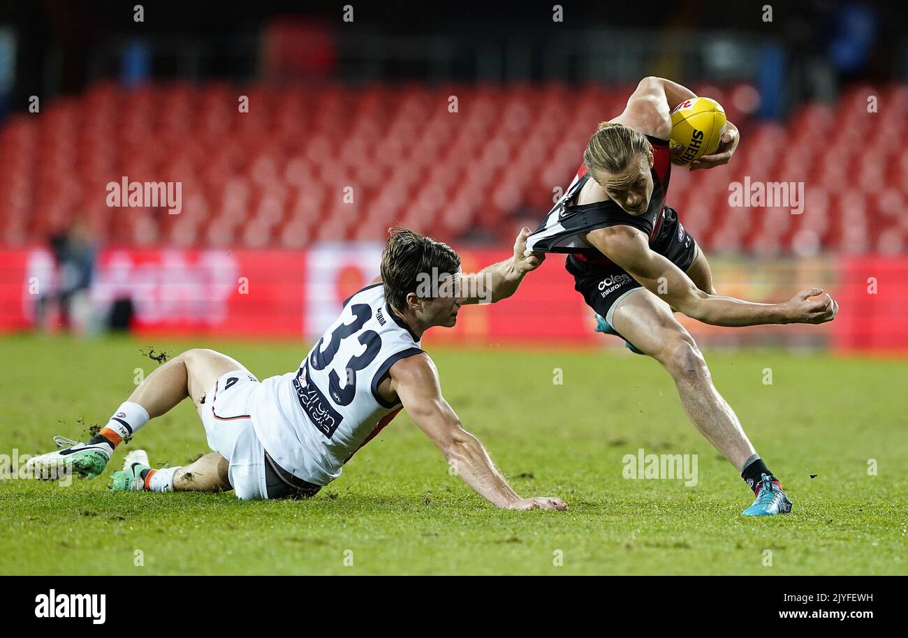 Xavier O’Halloran of the Giants attempts to tackle Mason Redman of the ...