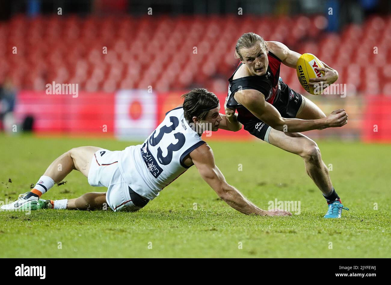 Xavier O’Halloran of the Giants attempts to tackle Mason Redman of the ...