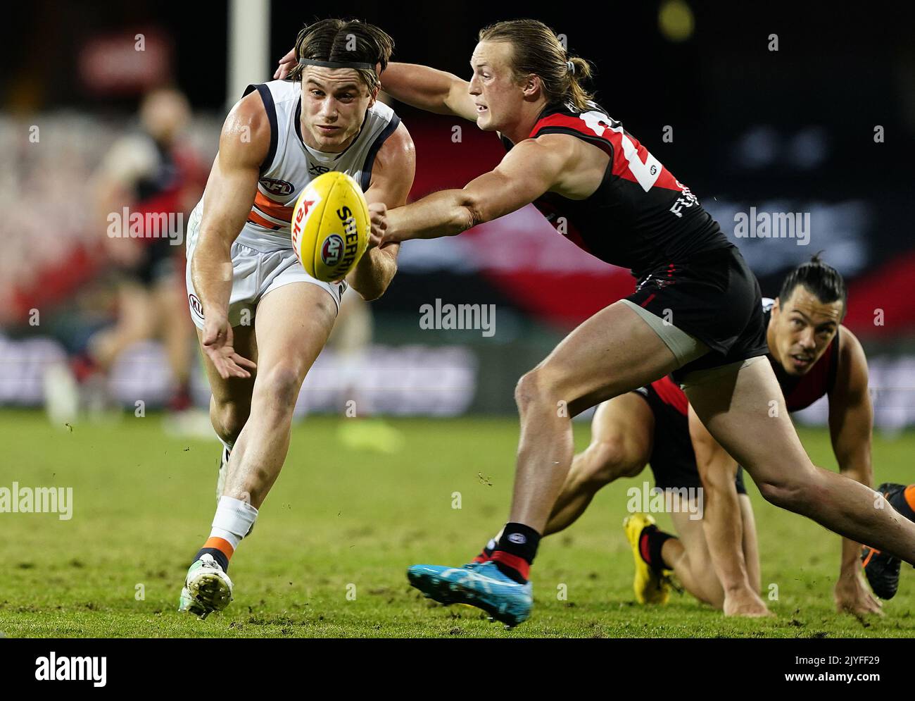 Xavier O’Halloran of the Giants (left) competes with Mason Redman of ...