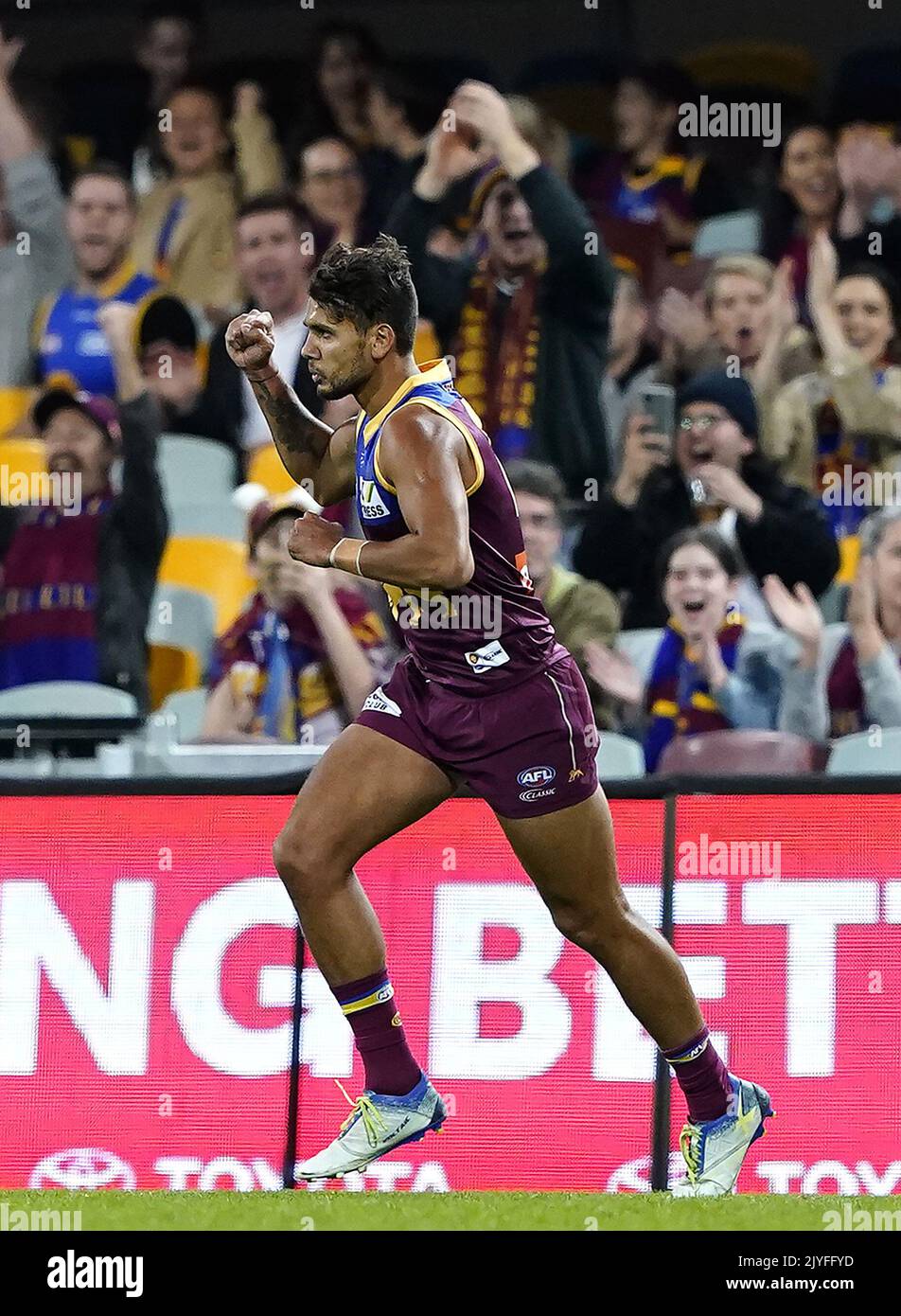 Callum Ah Chee of the Lions reacts after kicking a goal during the ...