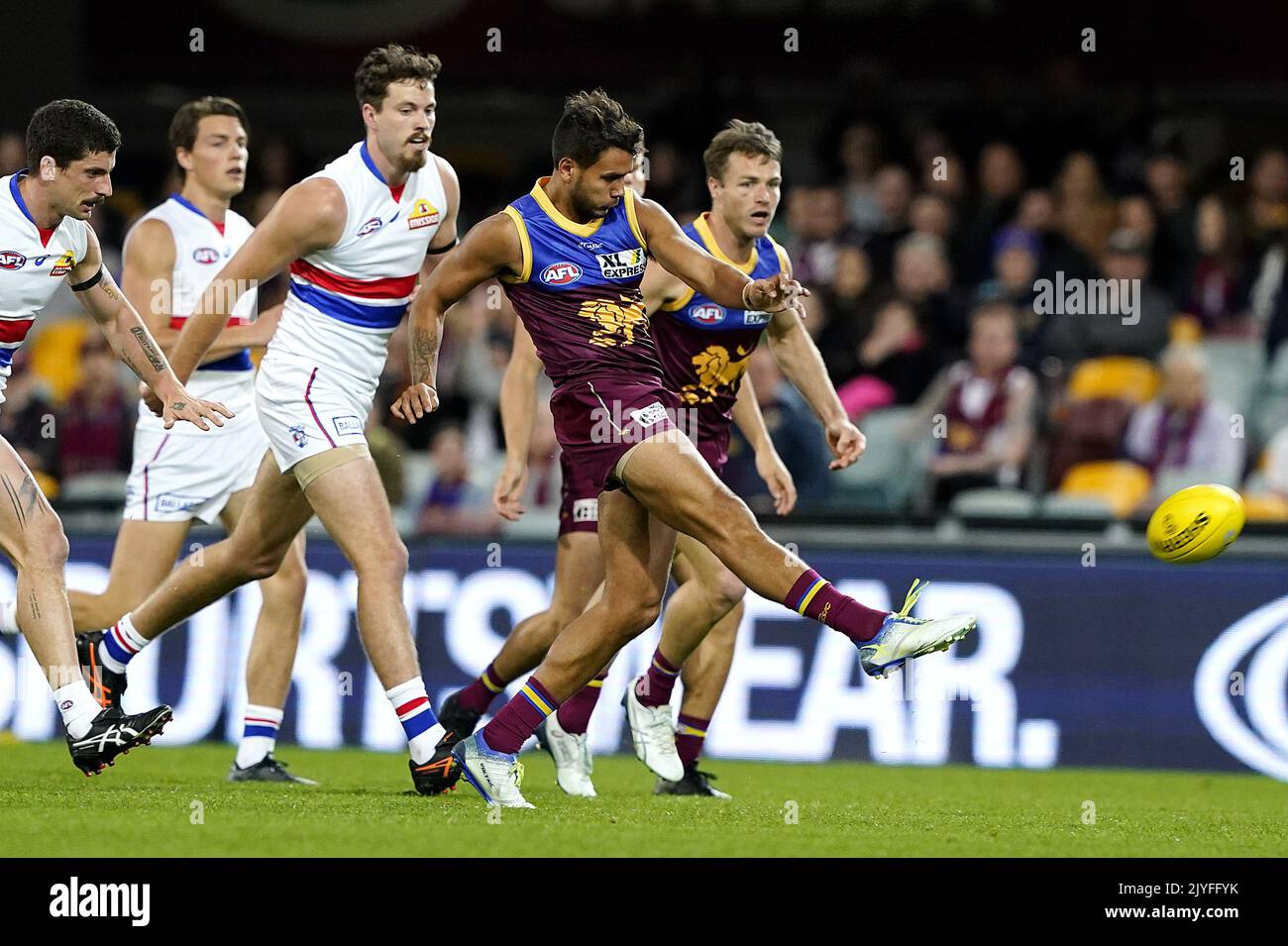 Callum Ah Chee of the Lions kicks for goal during the Round 11 AFL ...