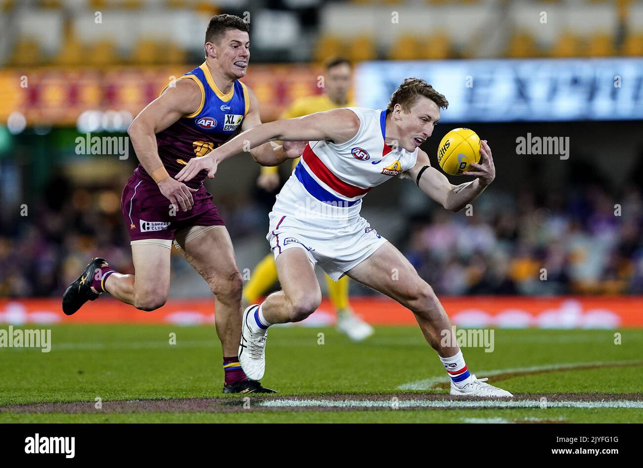 Bailey Dale of the Bulldogs (right) competes with Dayne Zorko of the ...