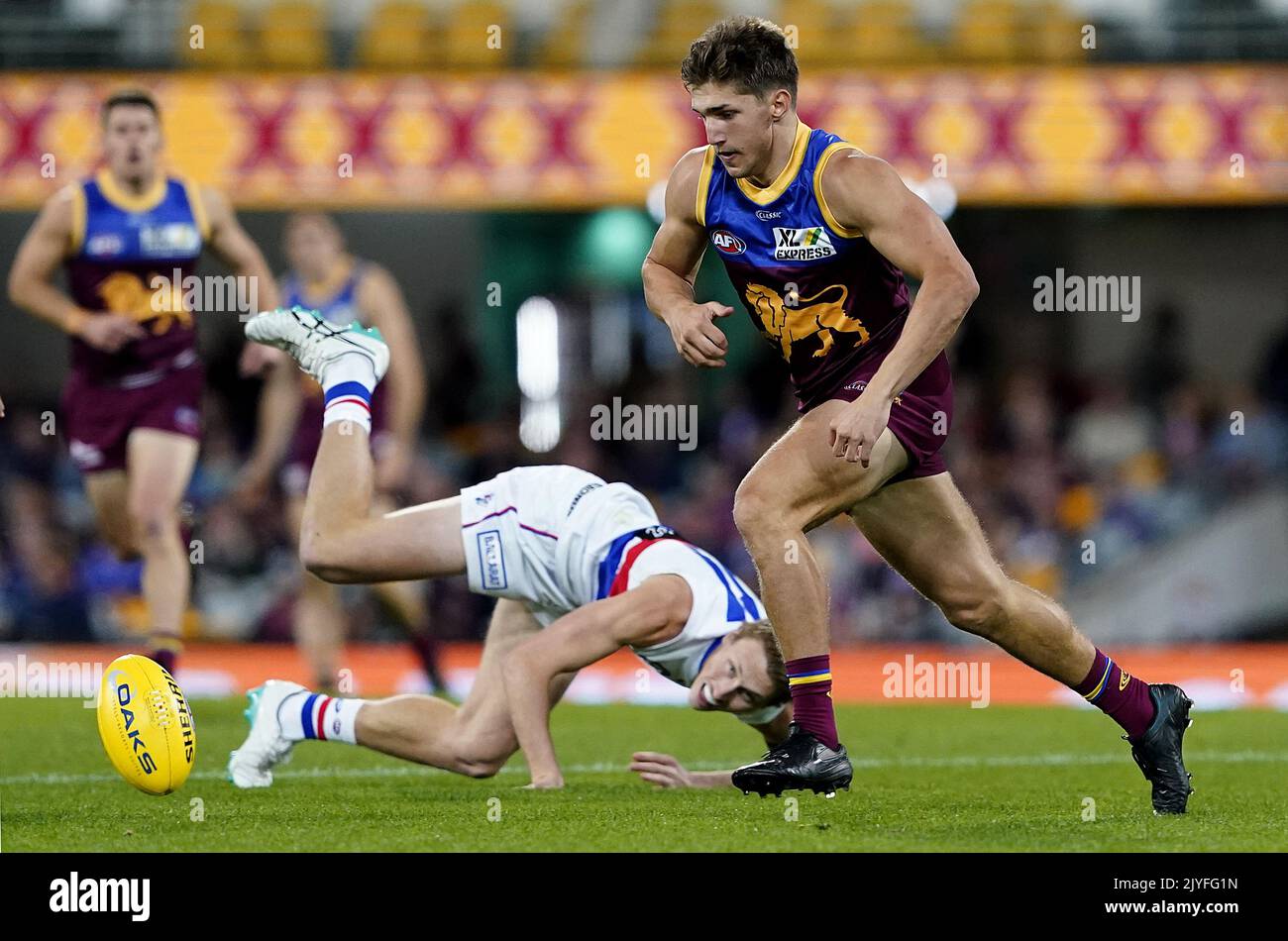Zac Bailey of the Lions (right) competes with Bailey Dale of the ...