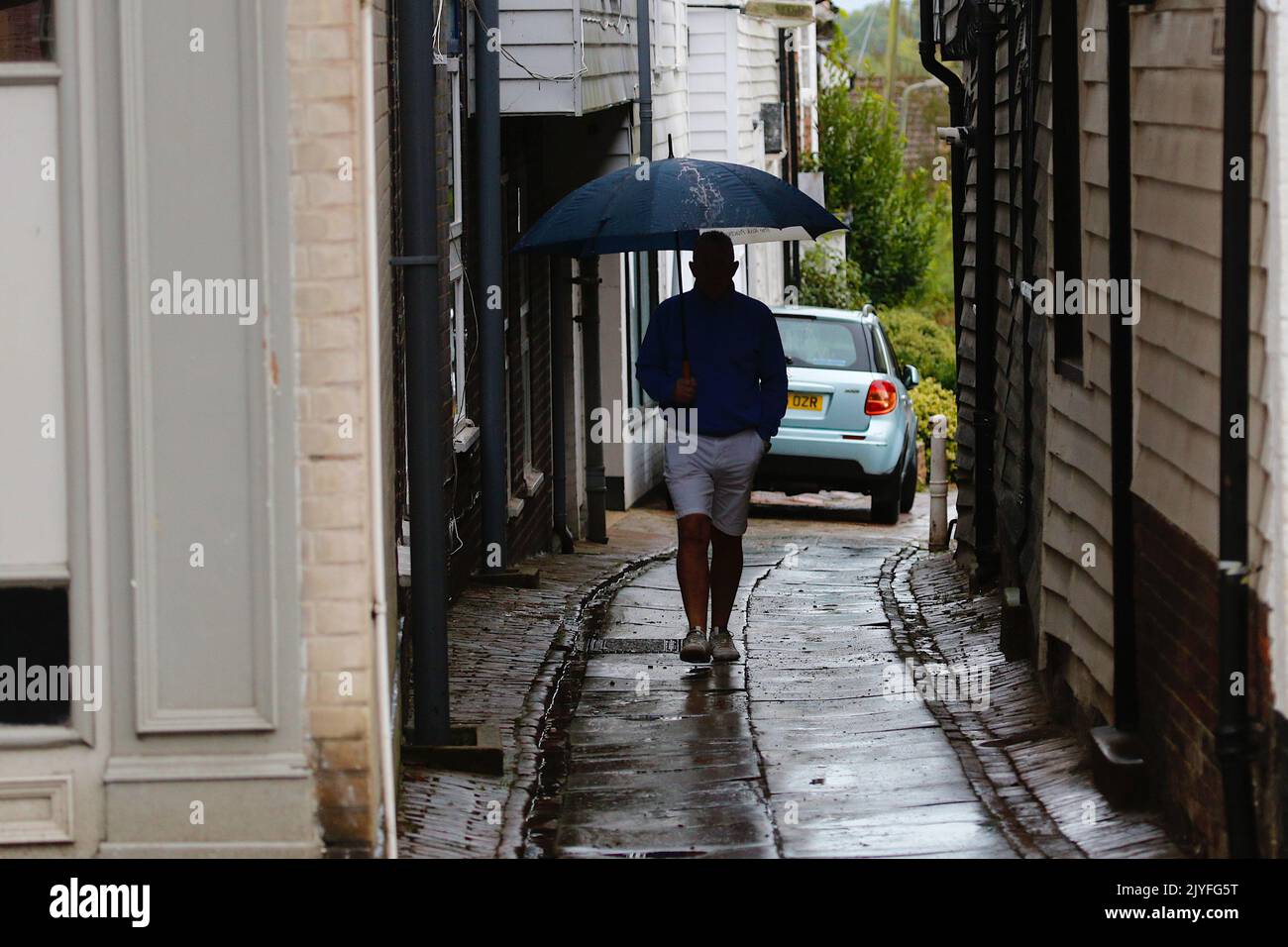 Raining and umbrellas hi-res stock photography and images - Alamy