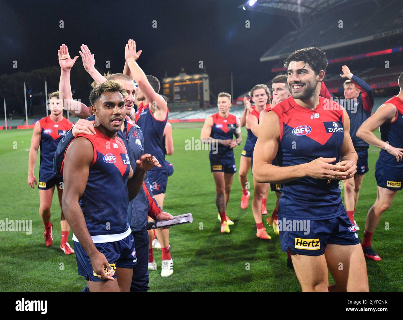 Demons players celebrate after the Round 11 AFL match between the North ...