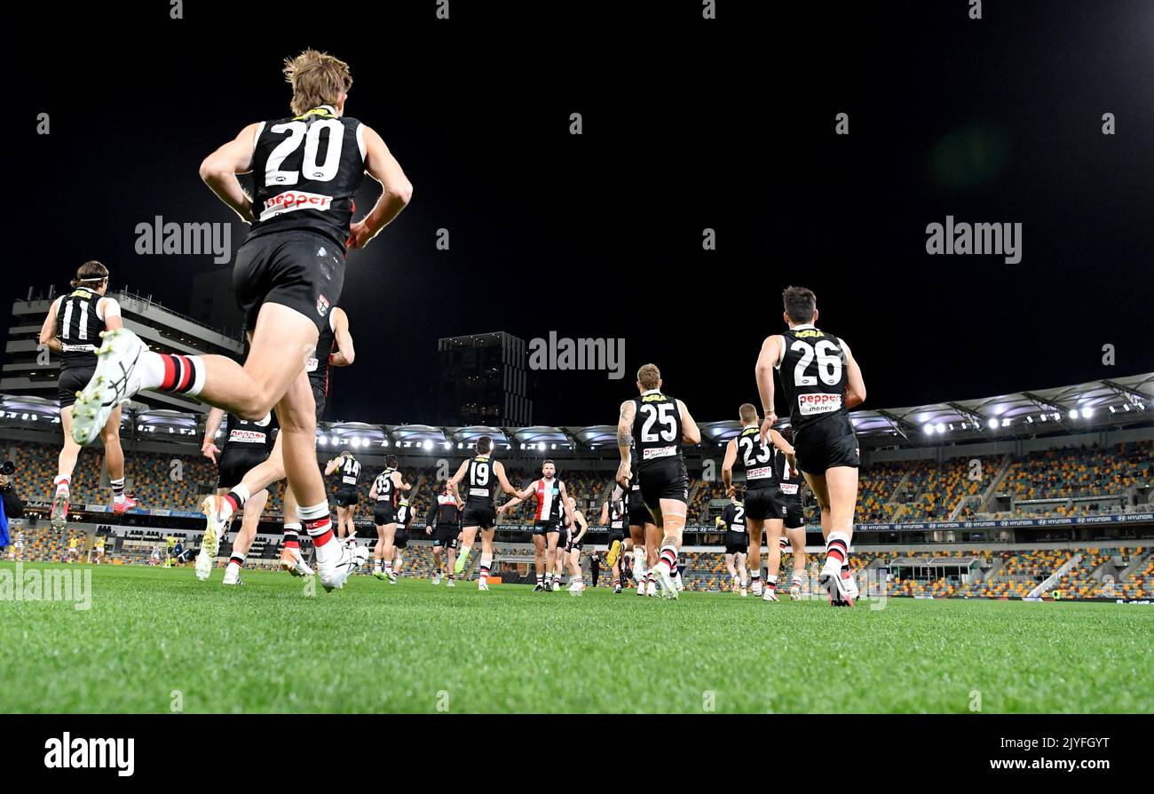 St Kilda players are seen running onto the field for the Round 11 AFL ...