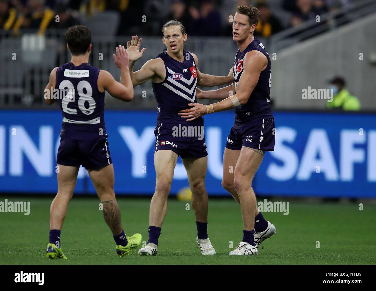 Nat Fyfe of the Dockers celebrates kicking a goal with Lachie Schultz ...