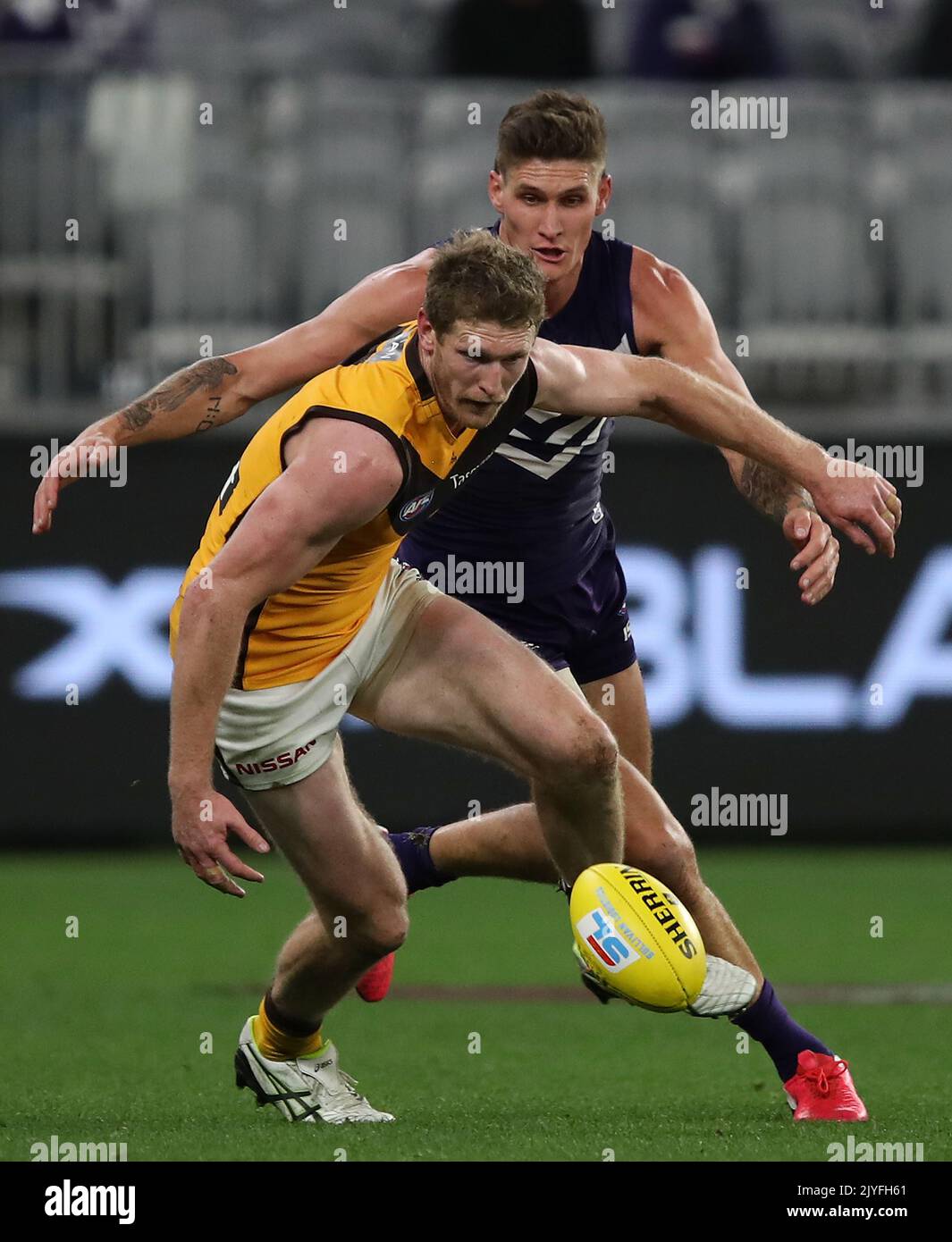 Ben McEvoy of the Hawks under pressure from Rory Lobb of the Dockers ...