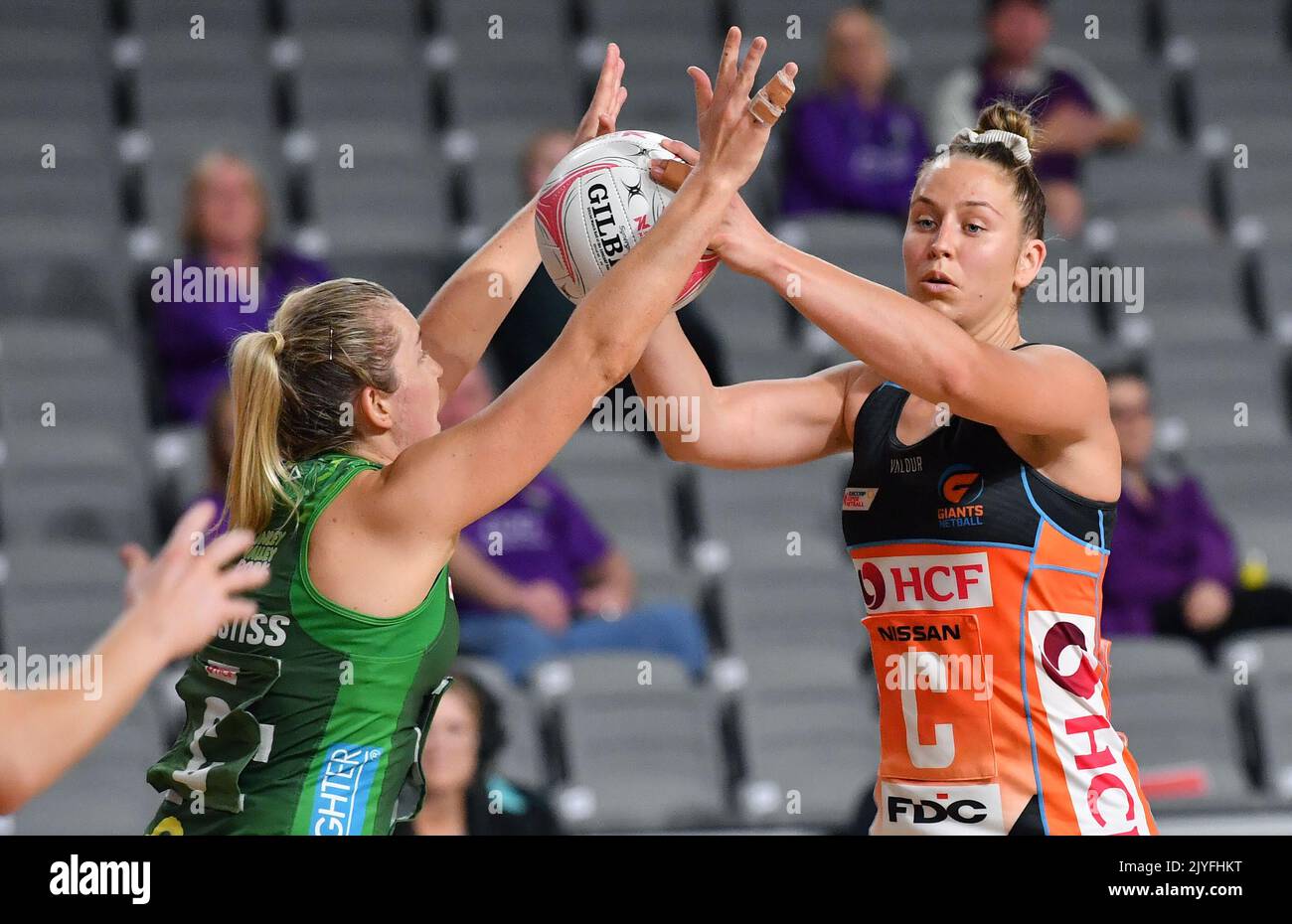 Jamie-Lee Price (right) of the Giants takes on Jess Anstiss (left) of ...