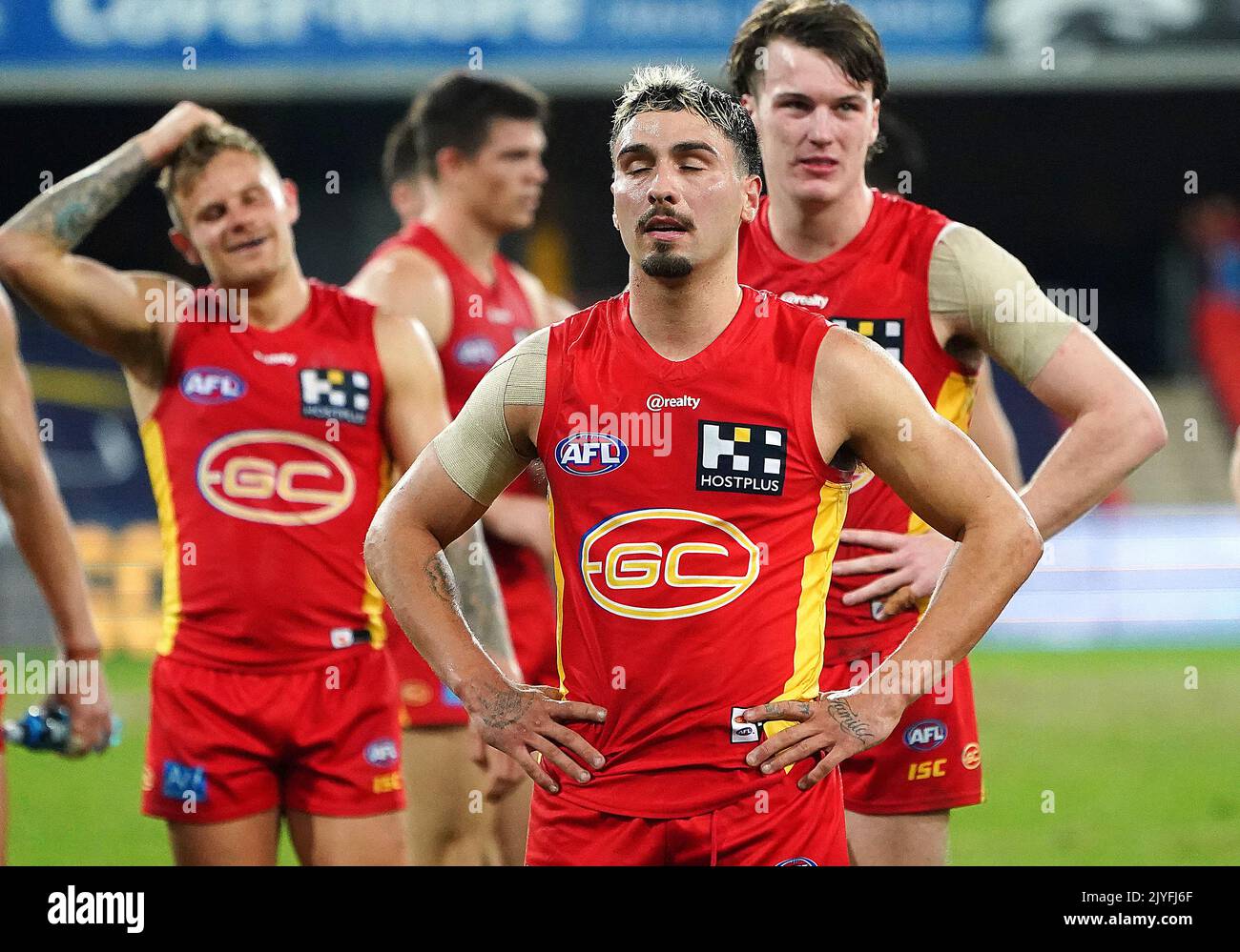 Izak Rankine of the Suns reacts as the players leave the field ...