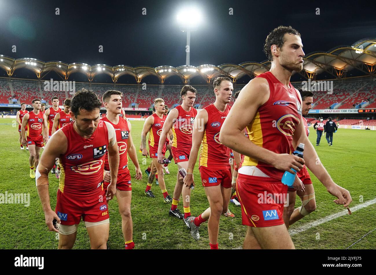 Suns players leave the field following the Round 11 AFL match between ...