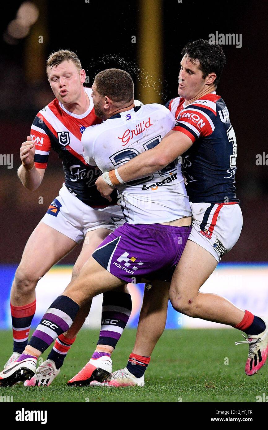 Brenko Lee of the Storm is tackled by Lindsay Collins (left) and Nat ...