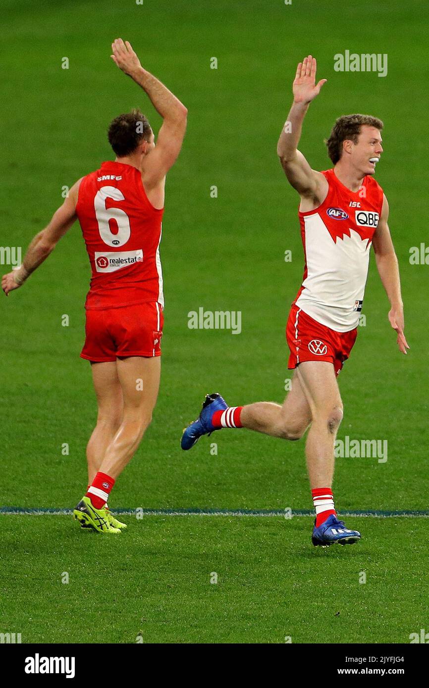 Nick Blakey (right) of the Swans celebrates after kicking a goal during ...