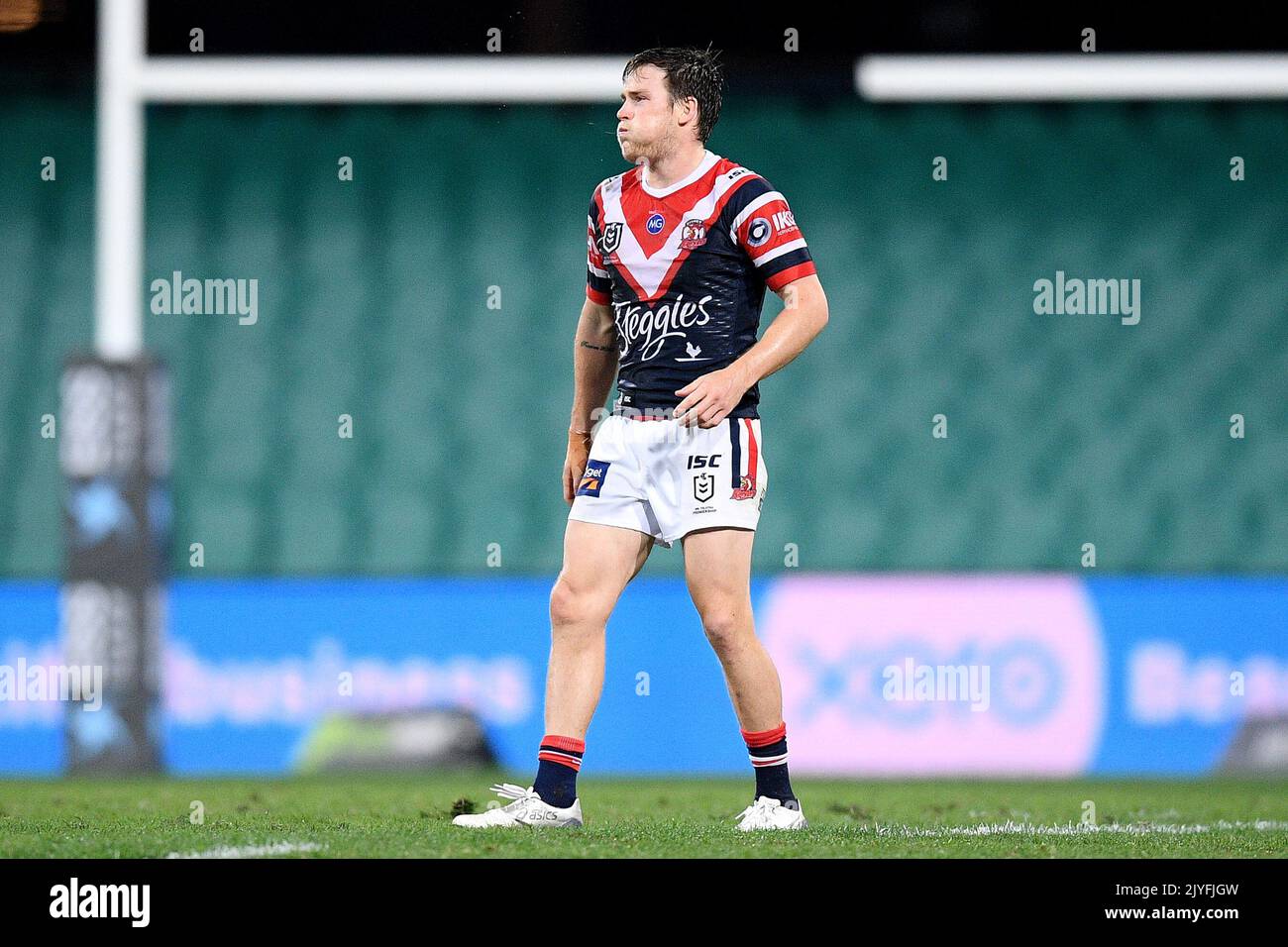 Luke Keary of the Roosters reacts after sustaining a rib injury during ...