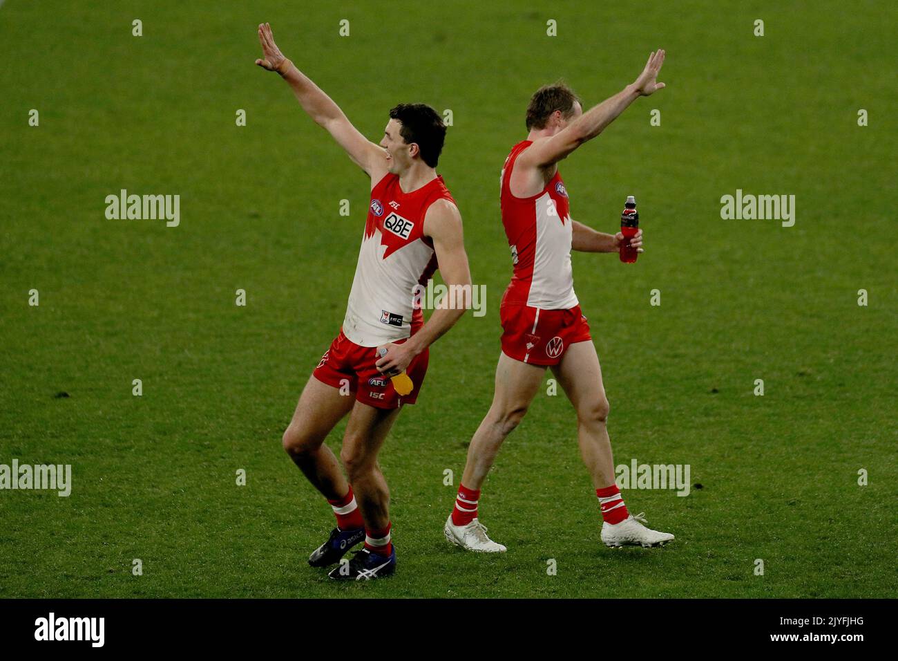 Tom McCartin (left) of the Swans celebrates after winning the round 12 ...