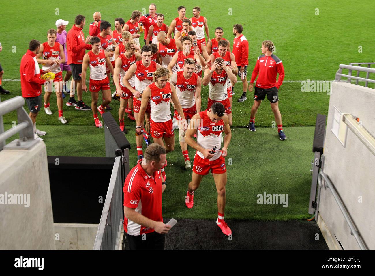 Zac Foot of the Swans is cheered off the field after making his debut ...