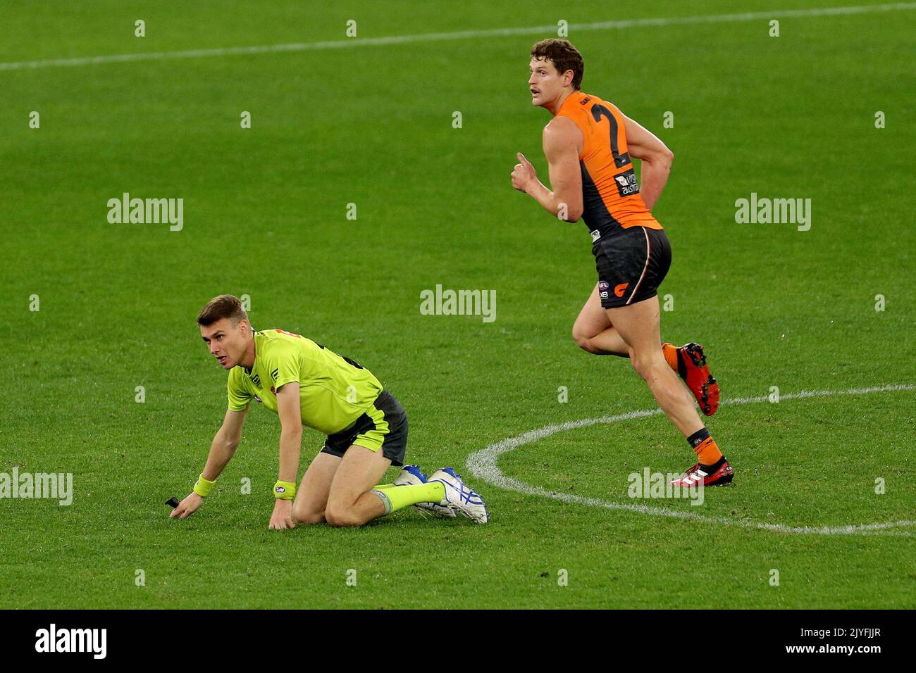 Umpire Jamie Broadbent reacts after a collision during round 12 AFL ...