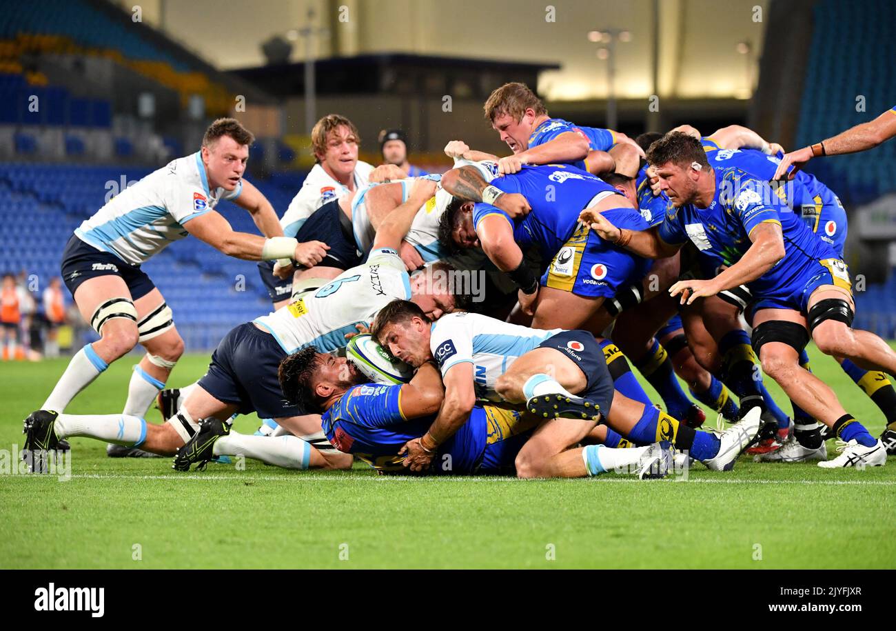 Henry Stowers (bottom centre) of the Force is held up over the try line ...