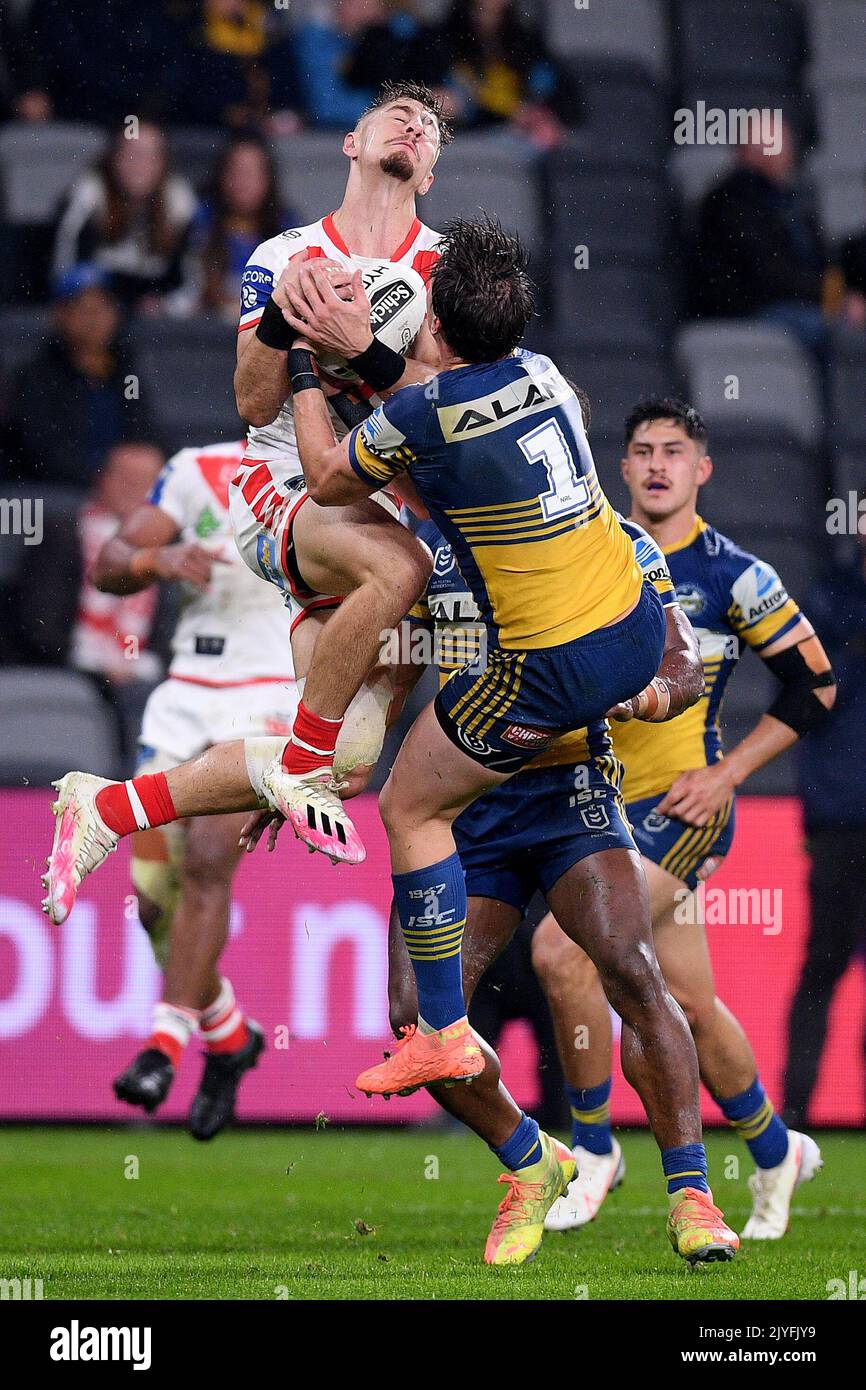 Zac Lomax of the Dragons takes a high ball to set up a Mikaele Ravalawa ...
