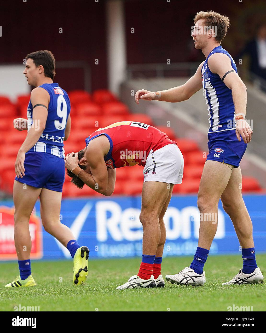 Jarryd Lyons of the Lions reacts after kicking a behind during the ...