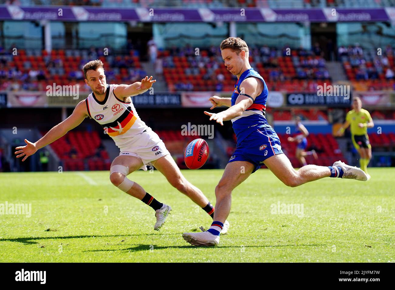 Lachie Hunter of the Bulldogs kicks during the Round 12 AFL match ...