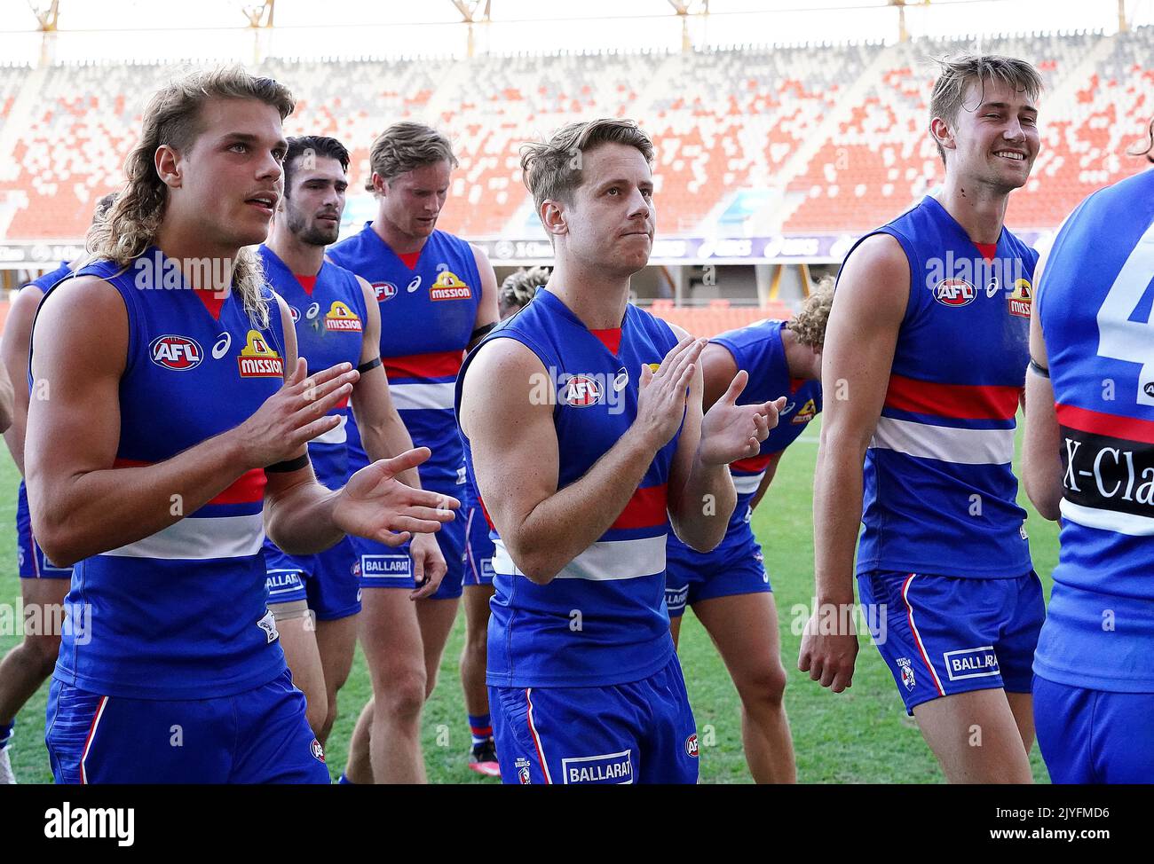 Lachie Hunter of the Bulldogs (centre) I seen as the team leaves the ...