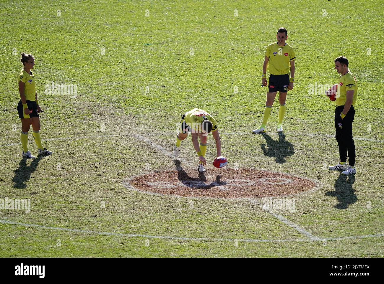 Umpires practice bouncing the ball at 3/4 time during the Round 12 AFL ...