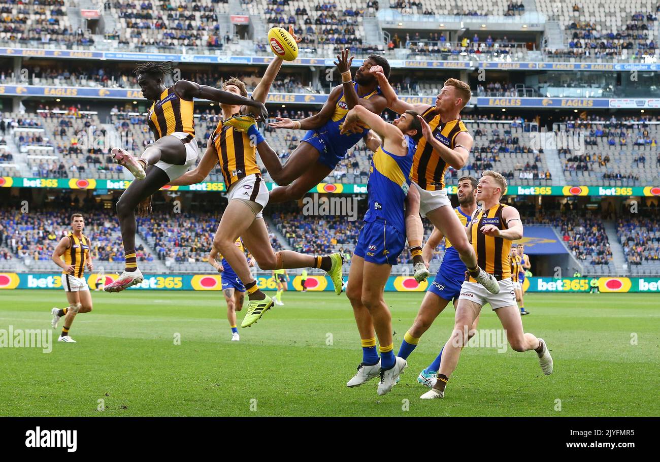 Changkuoth Jiath, Tim O’Brien and Jack Scrimshaw of the Hawks contests ...